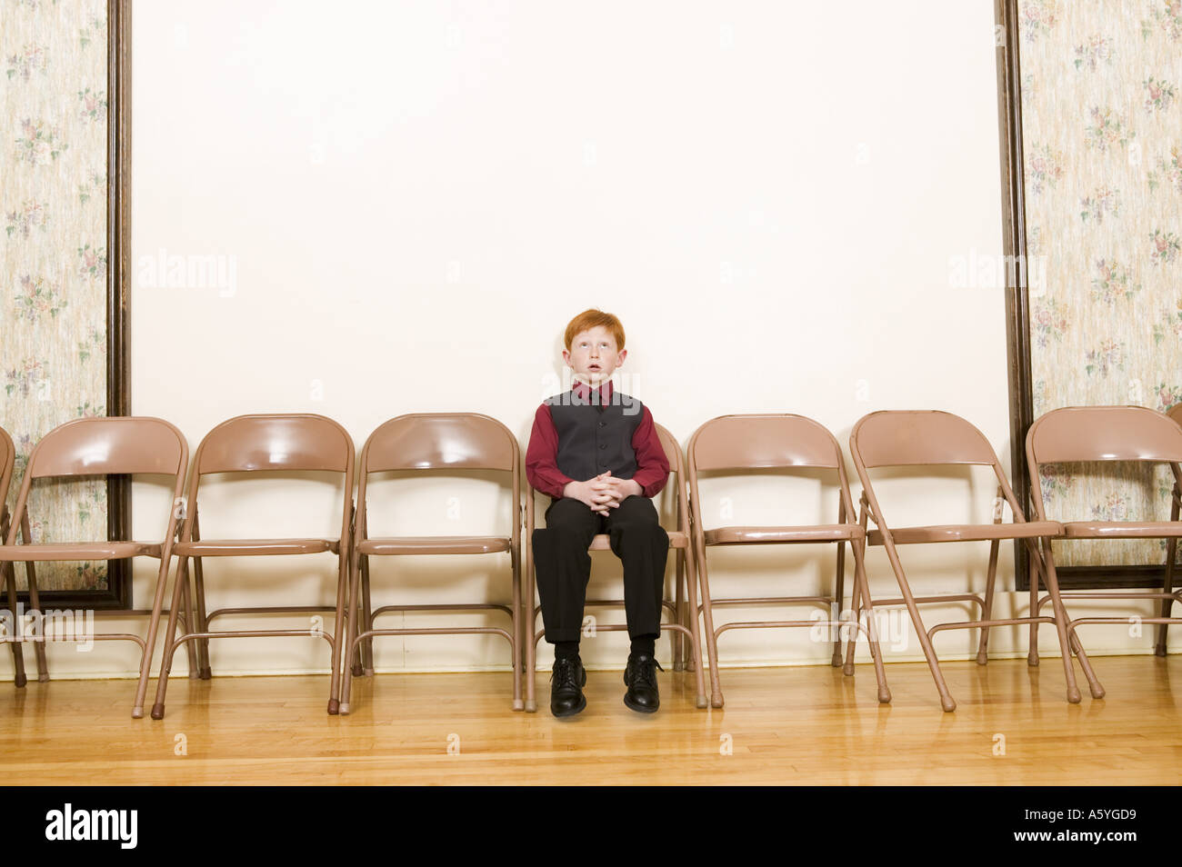 Boy sitting alone Stock Photo - Alamy