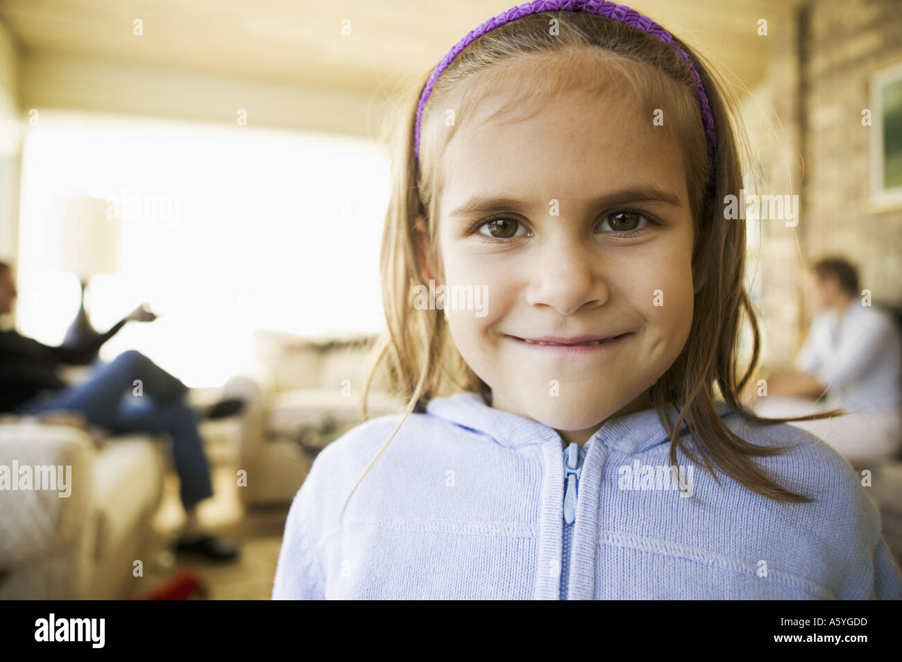 Portrait of girl smiling at camera Stock Photo - Alamy