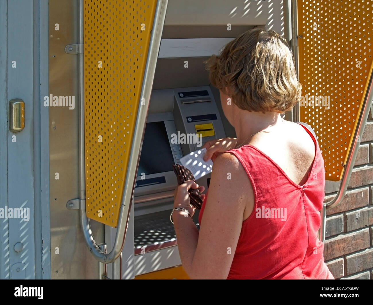 Woman getting money from atm hi-res stock photography and images - Alamy
