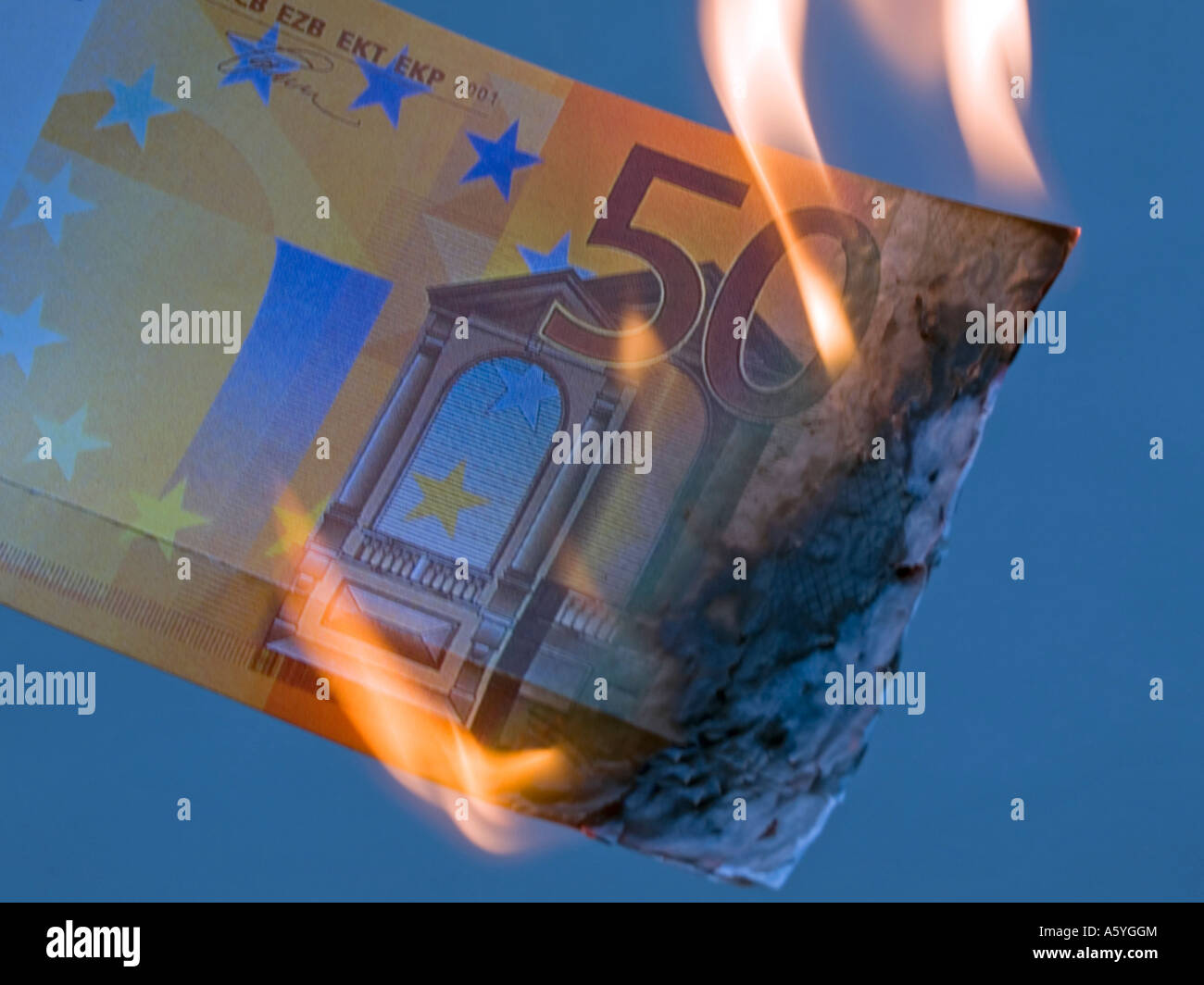 burning bank note 50 euro Stock Photo - Alamy