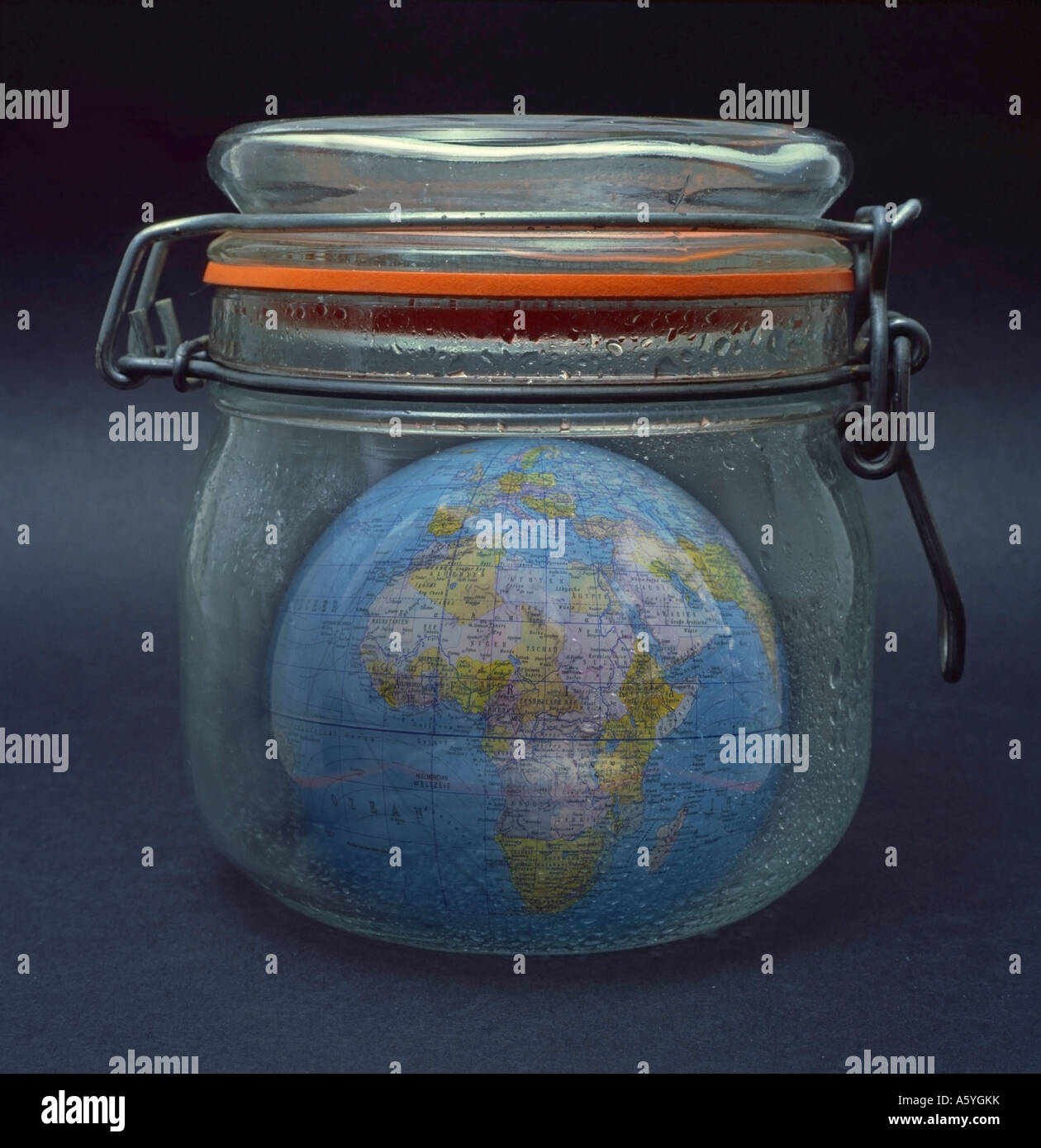 man destroying the earth globe in closed steaming preserving jar Stock ...