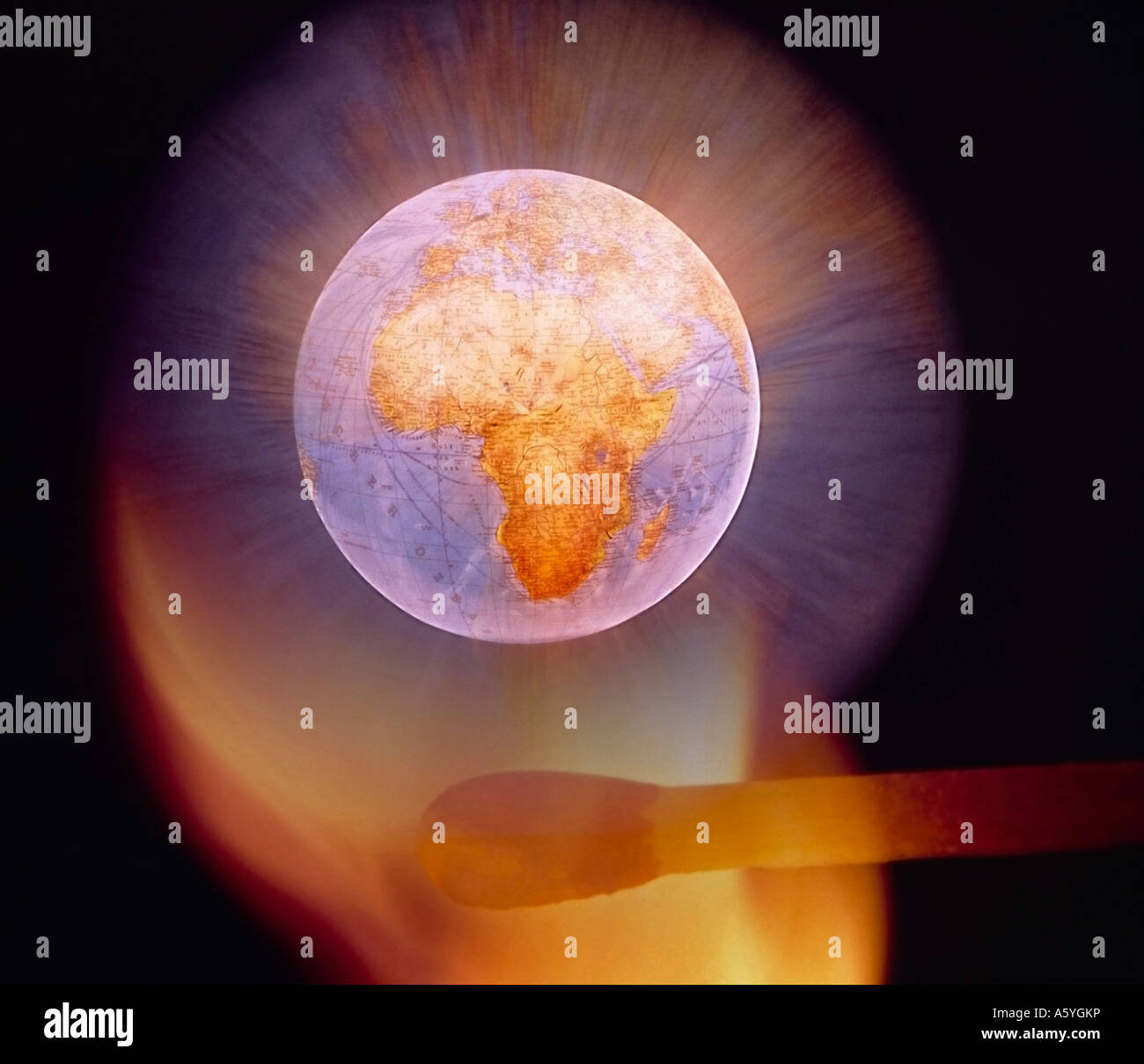 man destroying the earth globe in the flame of a match Stock Photo - Alamy