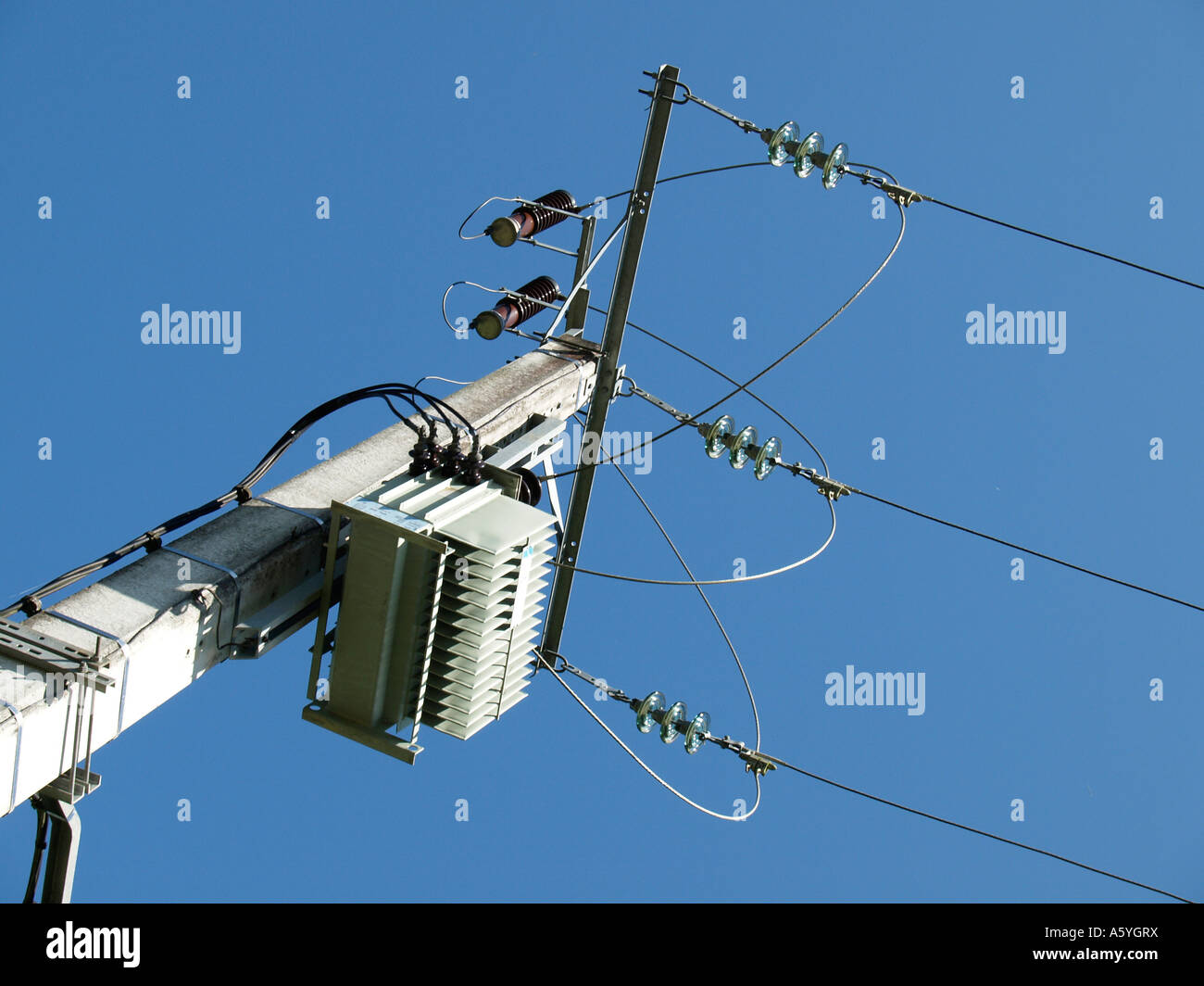 power lines at power pylon with transformer Stock Photo - Alamy