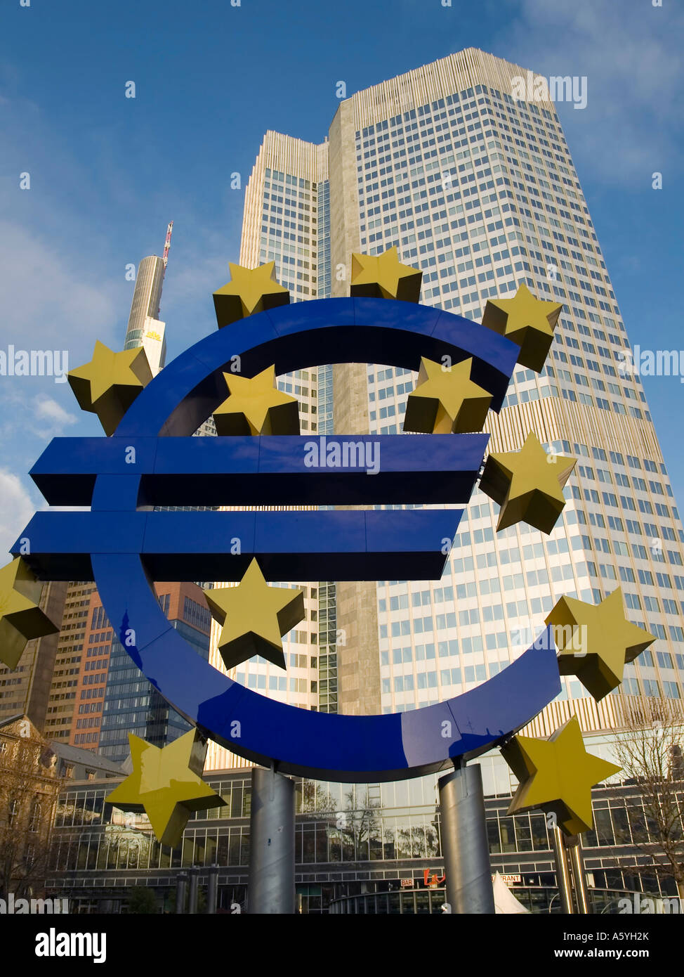 sign symbol for euro with euro stars in front of the building of ECB ...