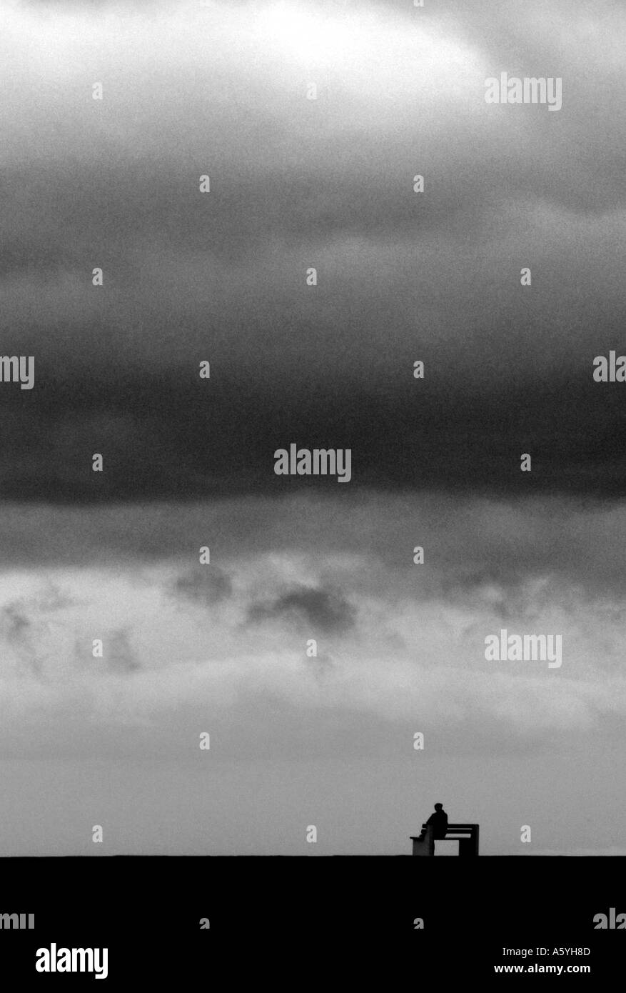 Figure sitting under hi-res stock photography and images - Alamy