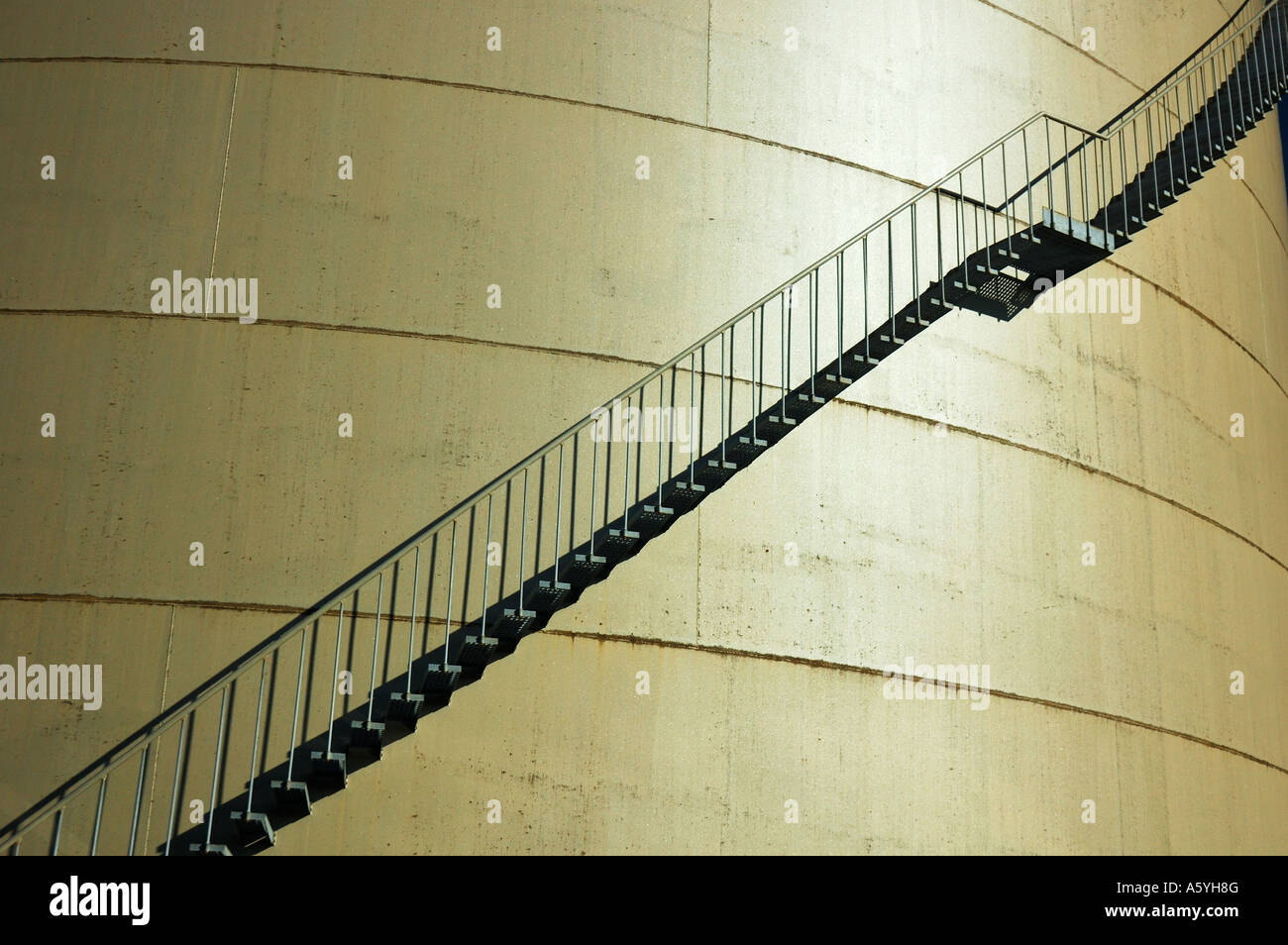 A line of steps up the side of an oil storage tank Stock Photo - Alamy