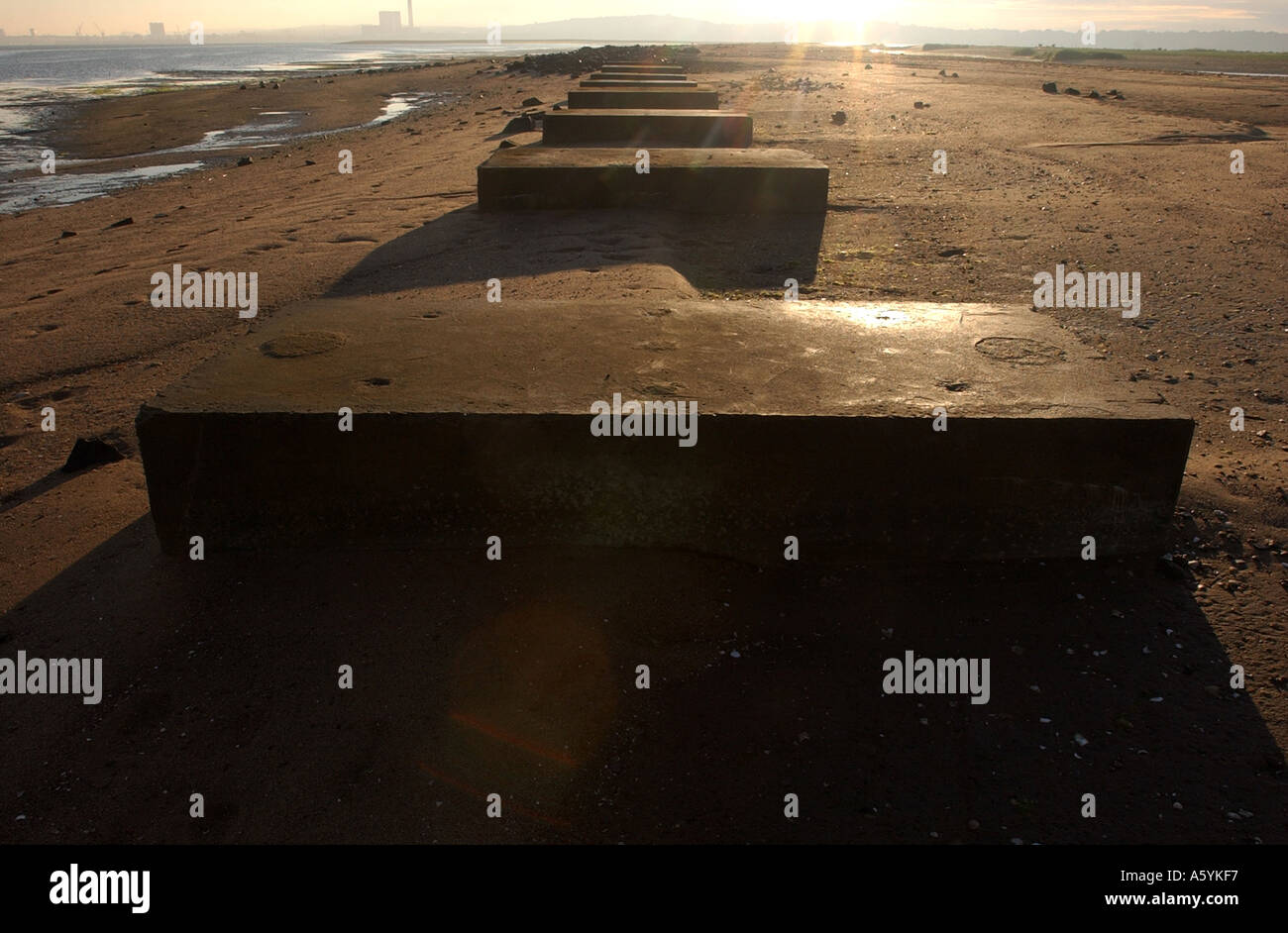 Pylons on a beach form abstract patterns Stock Photo - Alamy
