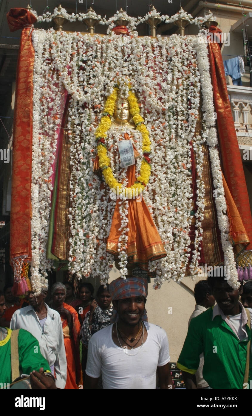 Man carrying idol of goddess Mariamman on his head for Karaga Festival ...