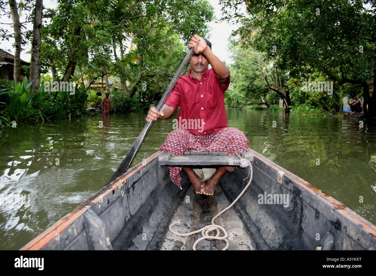 Indian man rowing a pirogue in kerala backwaters , India Stock Photo ...