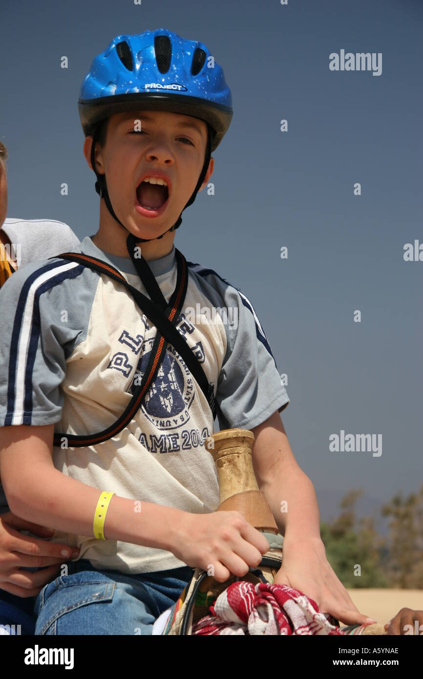 hippo therapy with camel / camel riding Stock Photo - Alamy