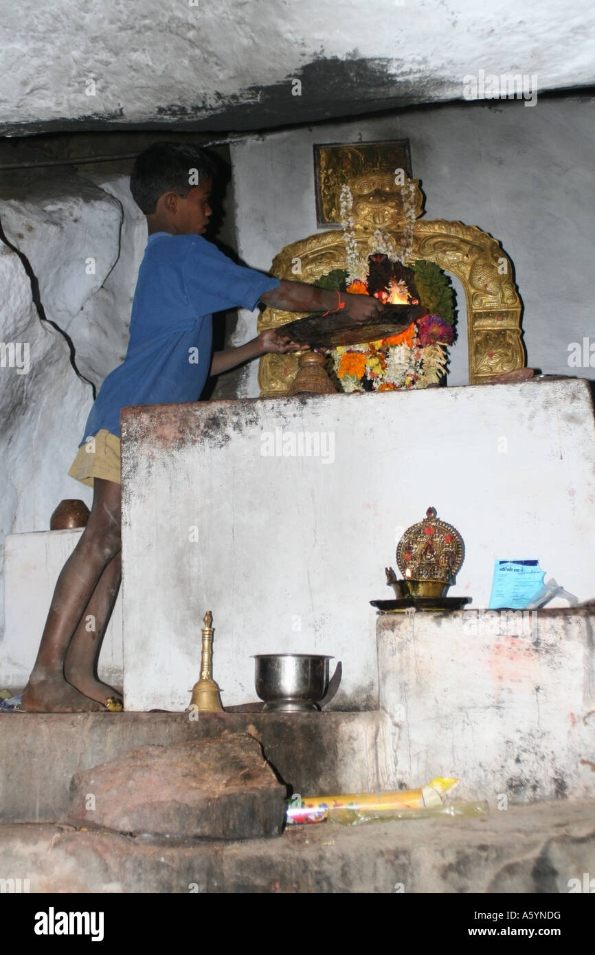 Hindus Boy performs pooja at a Venkateswara cave temple, Tamil Nadu ...
