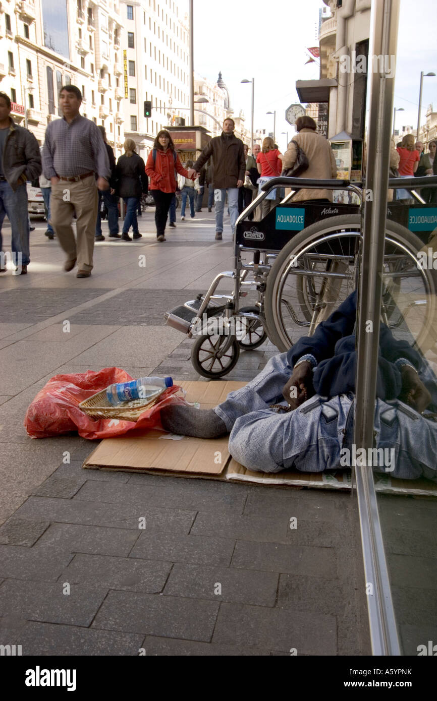 Rich poor divide inequality, disabled homeless beggar with wheelchair ...