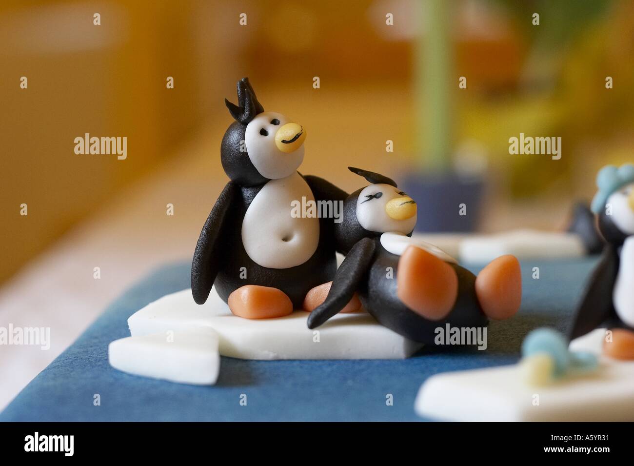penguin figures of marzipan on a cake Stock Photo - Alamy