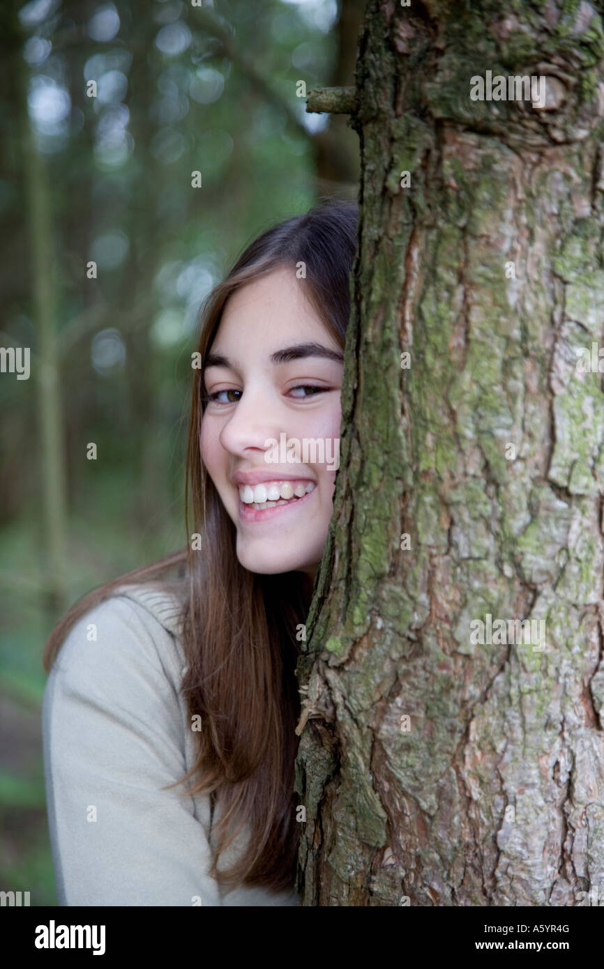 Tree hugging teenage girl Stock Photo - Alamy