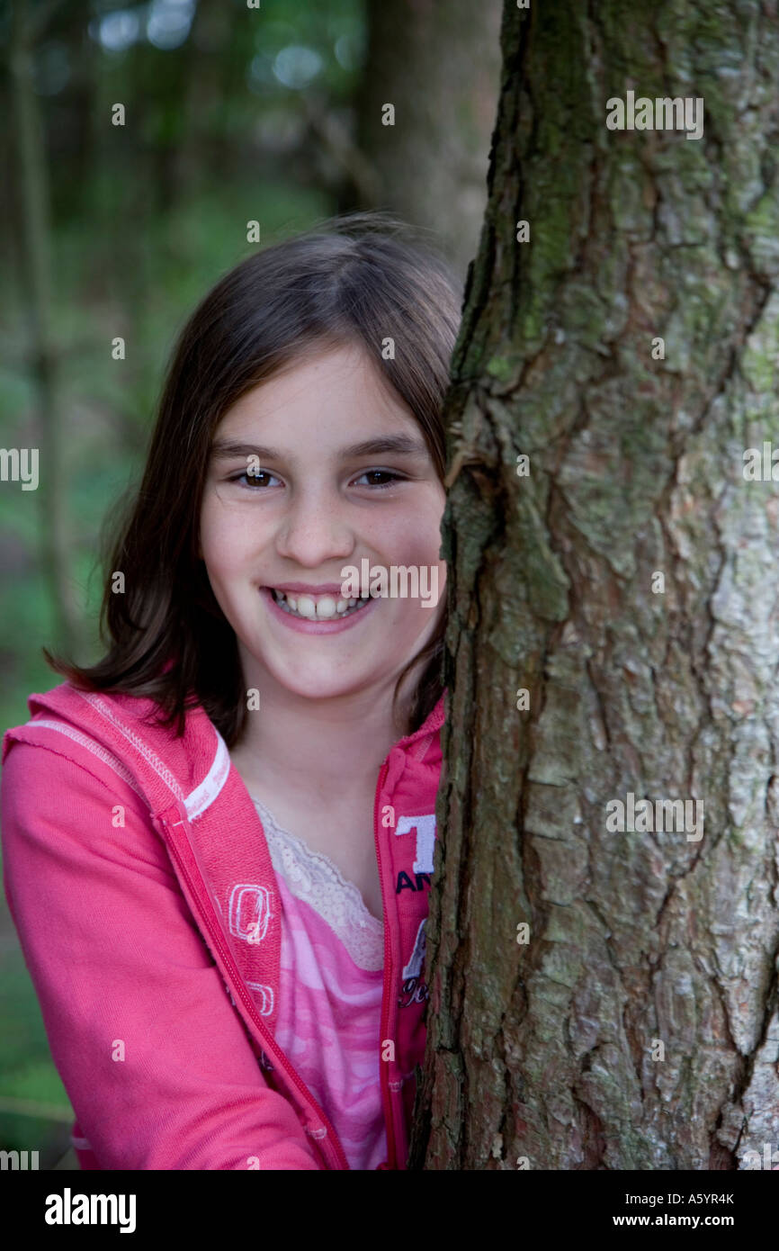 Tree hugging teenage girl Stock Photo - Alamy