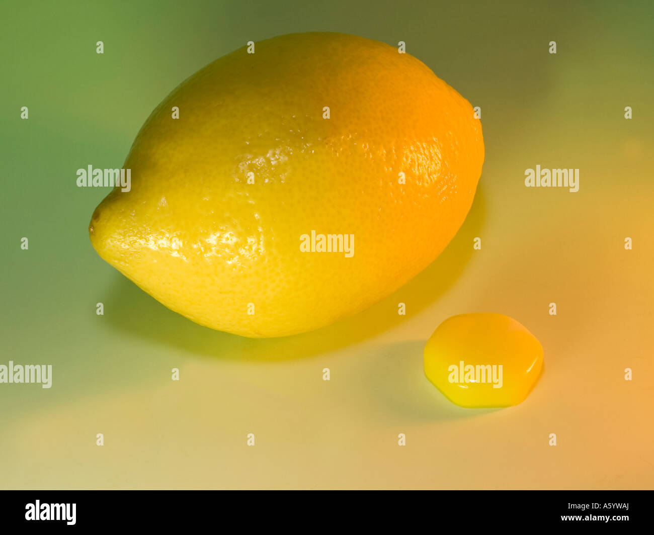 lemon with a yellow lemon candy goody sweat Stock Photo - Alamy