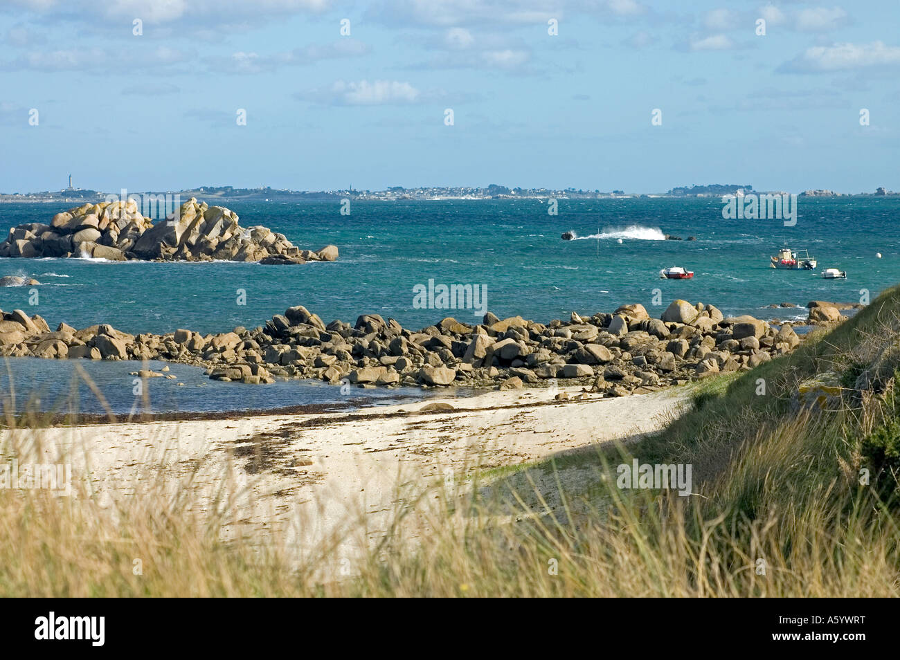 stony strand with sand and granit rocks at the coast in Finistere near ...
