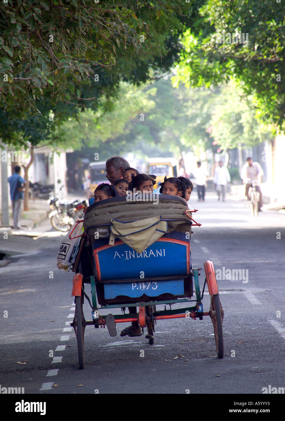 Indian school children on the way to school in a rickshaw, Pondicherry ...