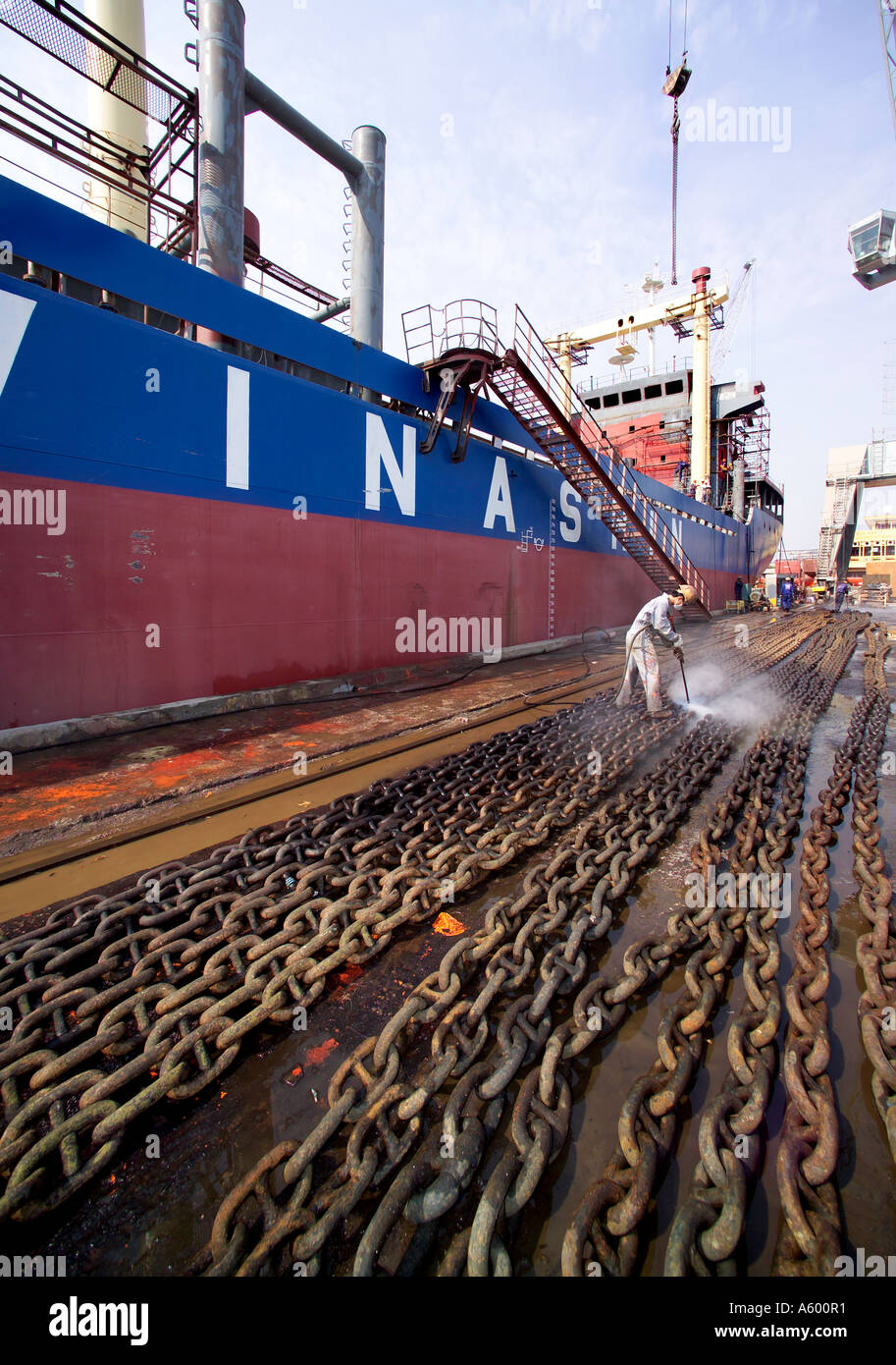 Chain being pressure washed in Vietnamese shipyard, Asia Stock Photo ...