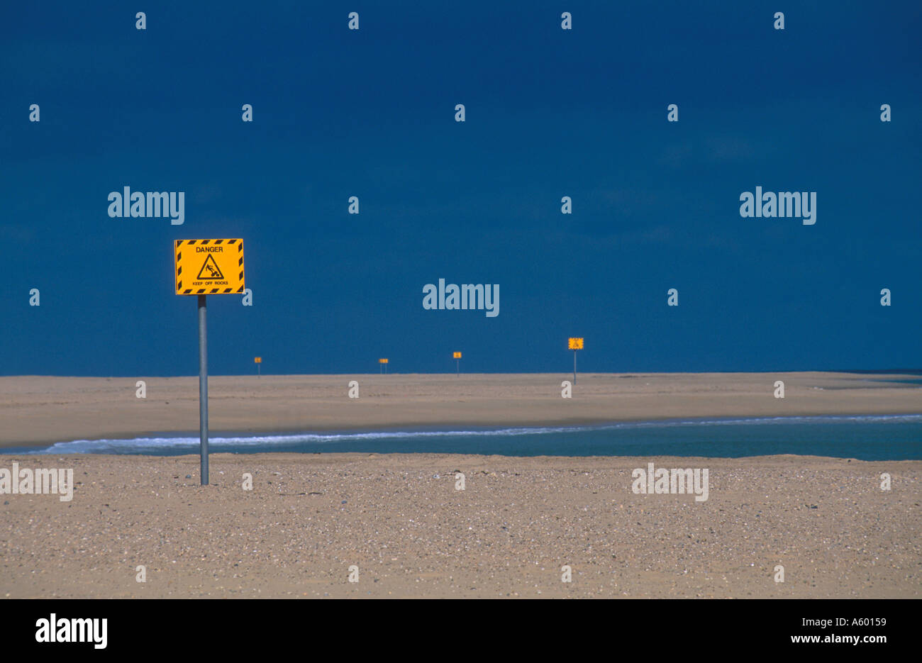 WARNING SIGNS ON BEACH AT SEA PALLING ABOUT REEF ROCKS NORFOLK EAST ...