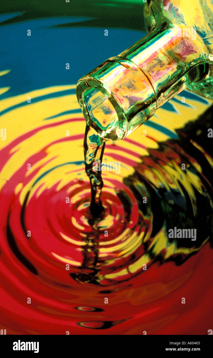 Glass bottle pouring water Stock Photo - Alamy