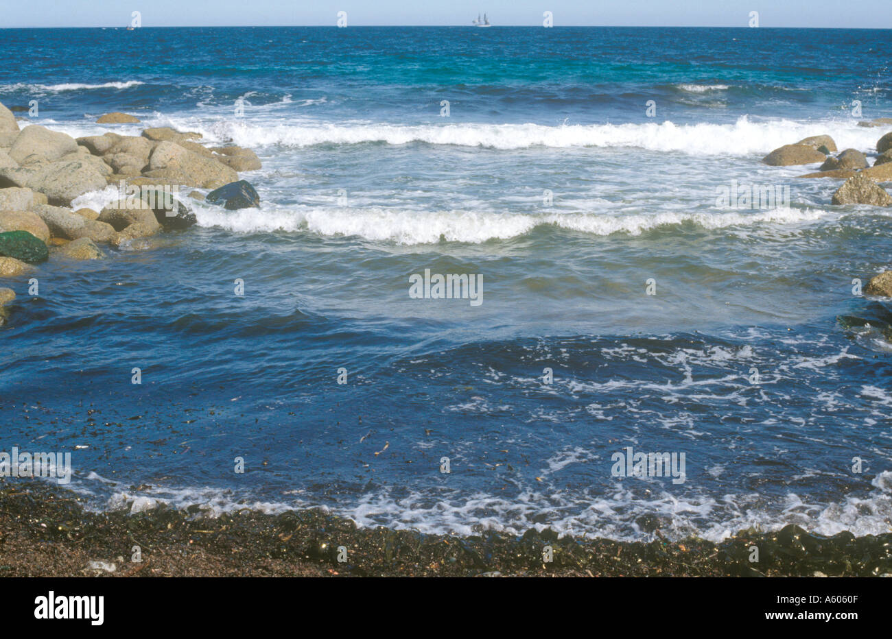 Cornish Inlet with Distant Sailing Ship Stock Photo - Alamy