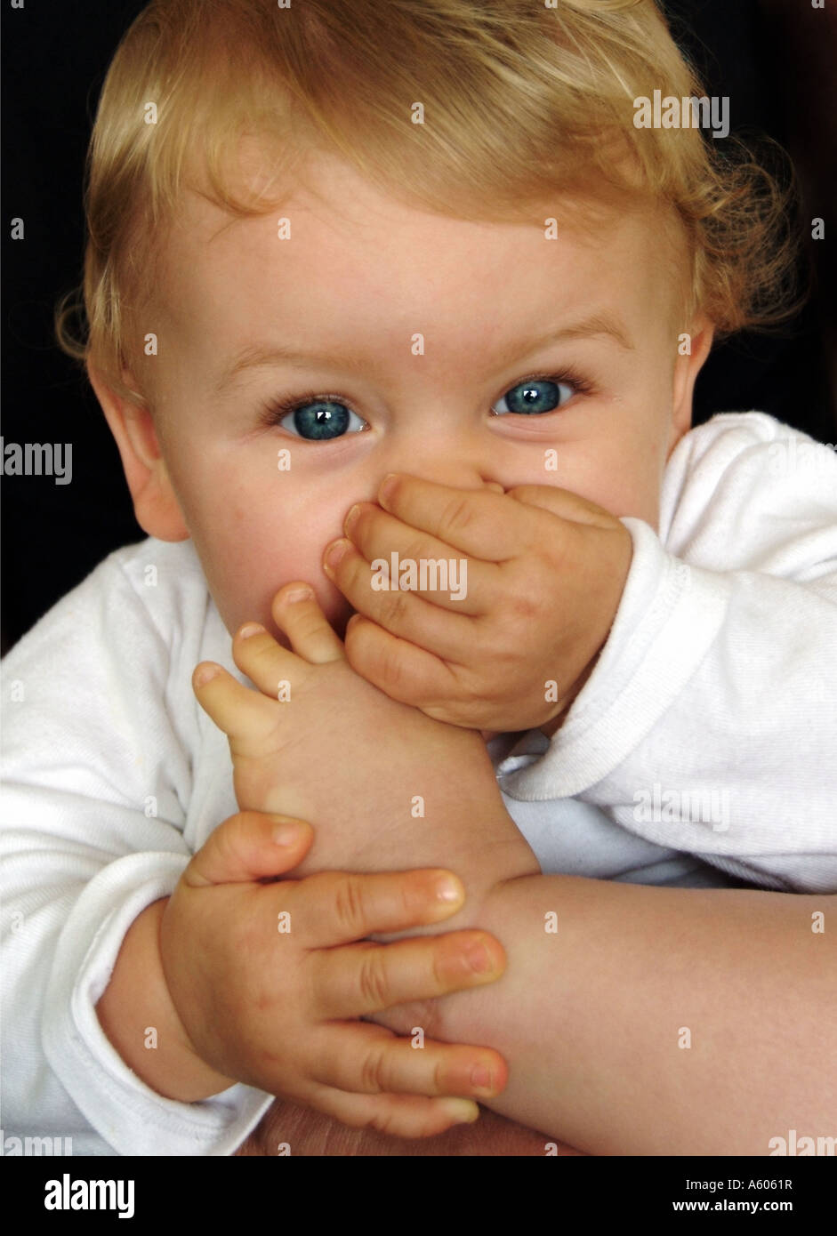 Baby girl chewing feet hi-res stock photography and images - Alamy