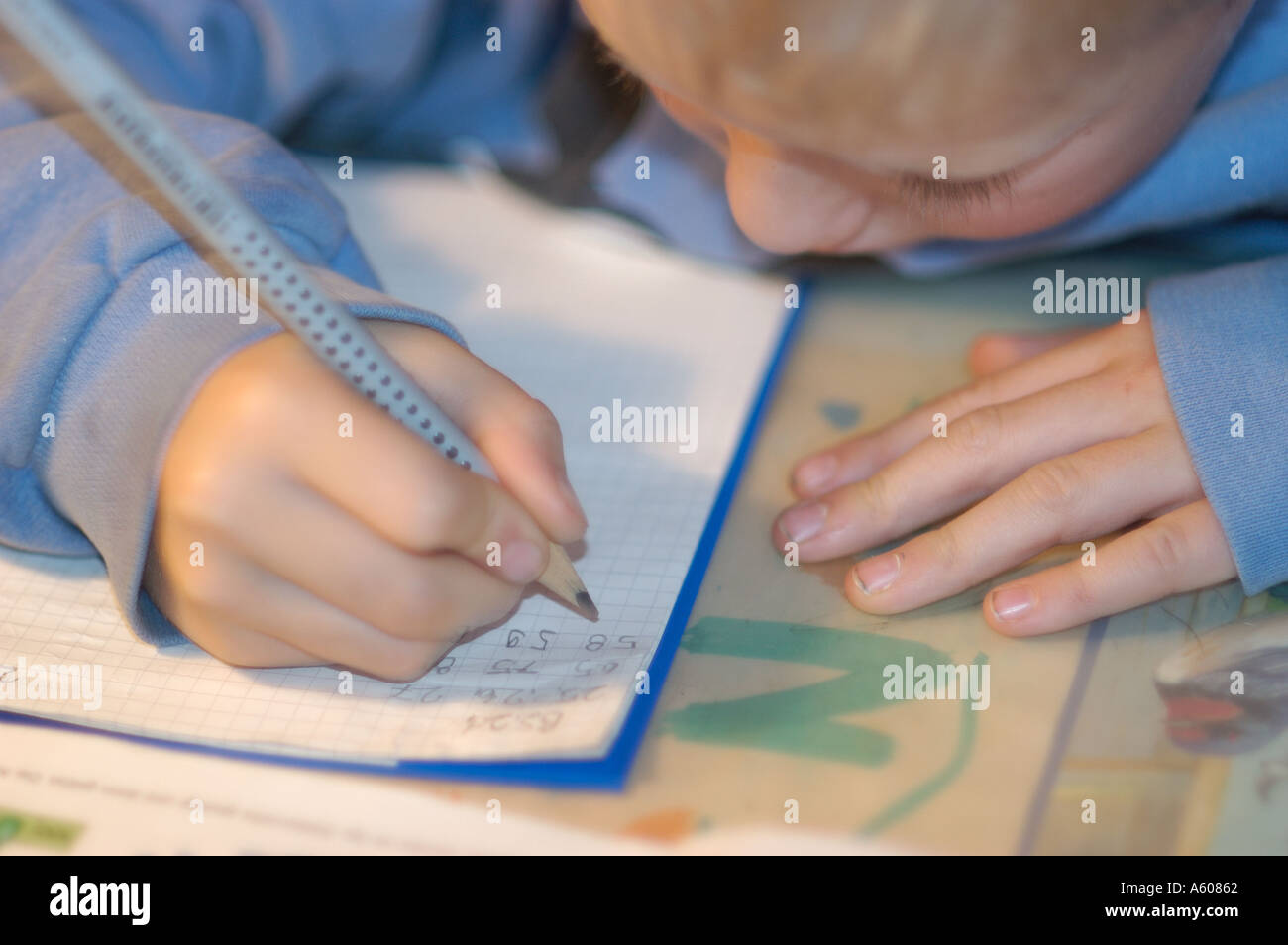 Little boy doing his homework Stock Photo - Alamy
