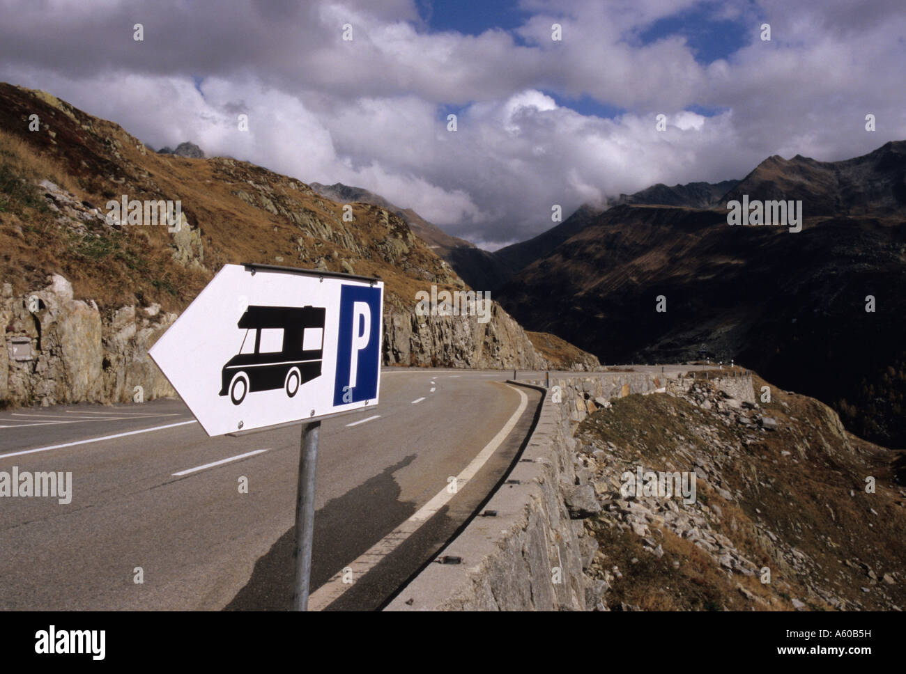 mountain road on the Swiss Alps and parking sign for caravans and ...