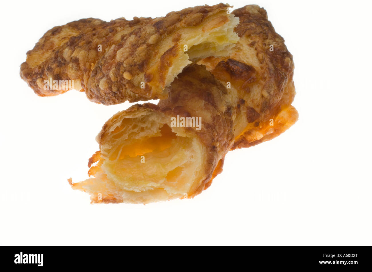 Broken cheese straw on white background Stock Photo - Alamy