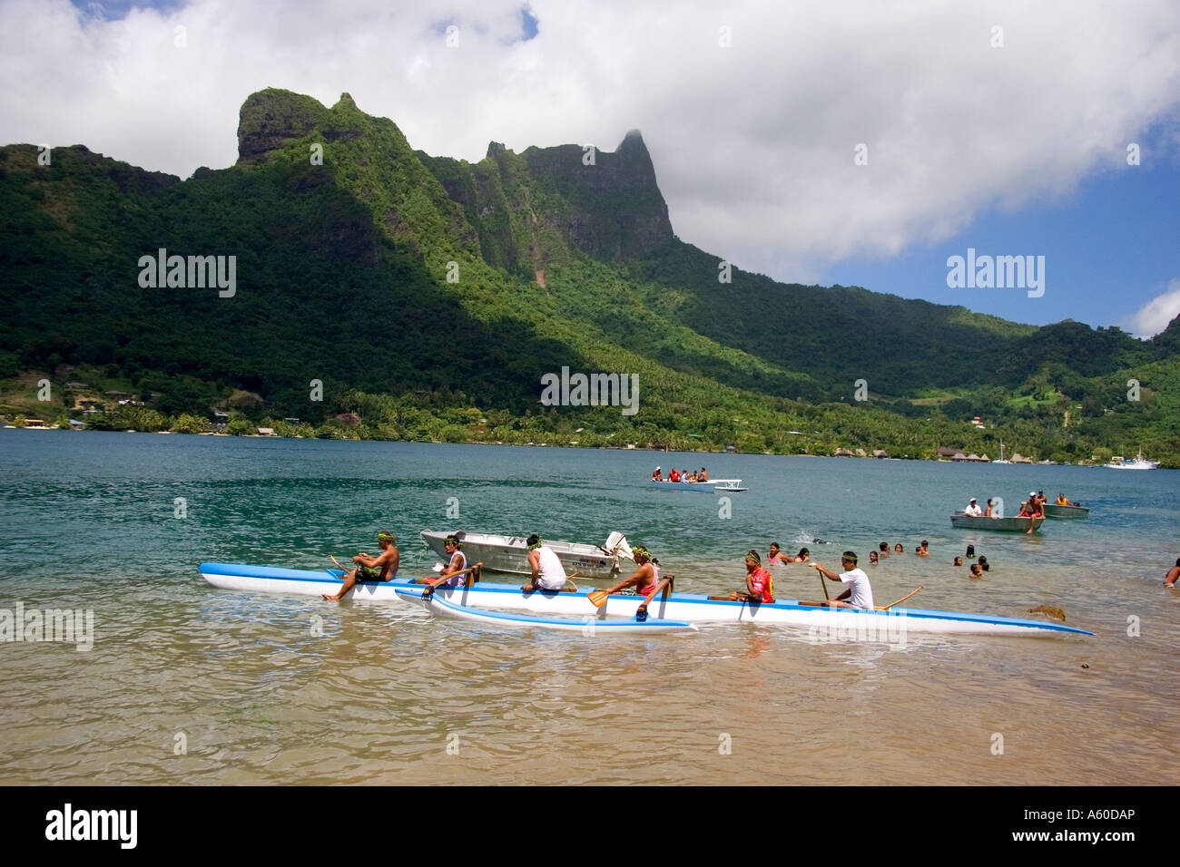 Tahitians take part in an outrigger canoe pirogue race off the island ...