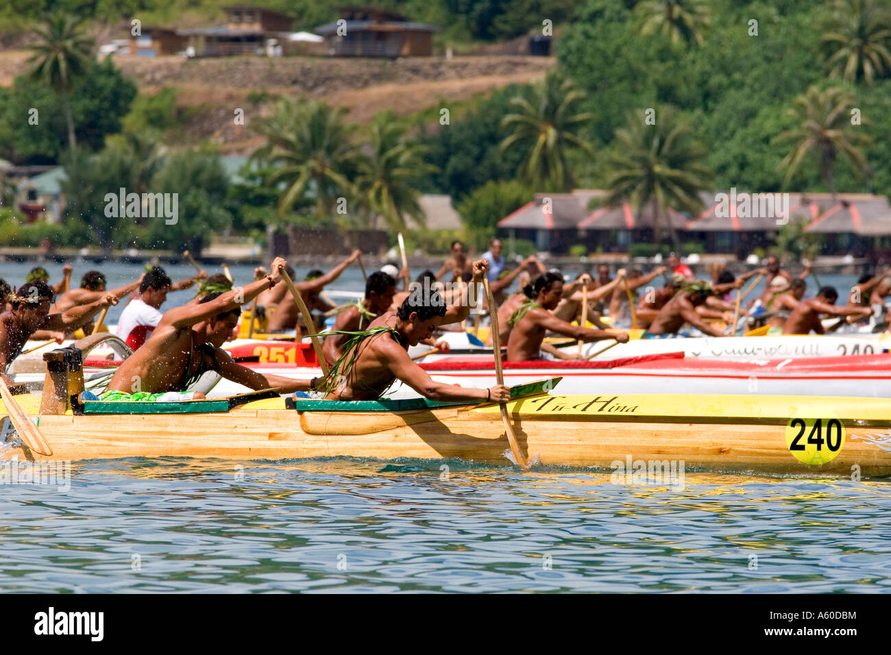 Tahitians take part in an outrigger canoe pirogue race off the island ...