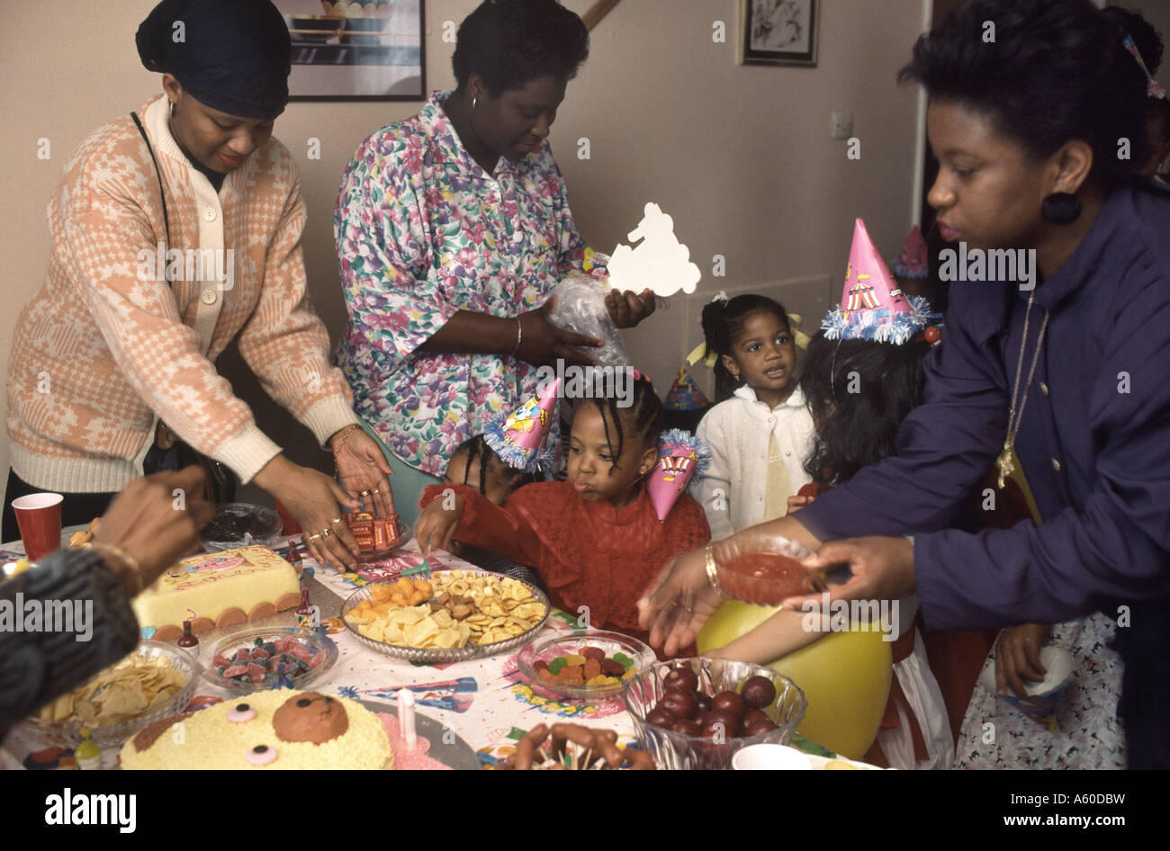 Birthday party for a one year old with mothers serving the children ...