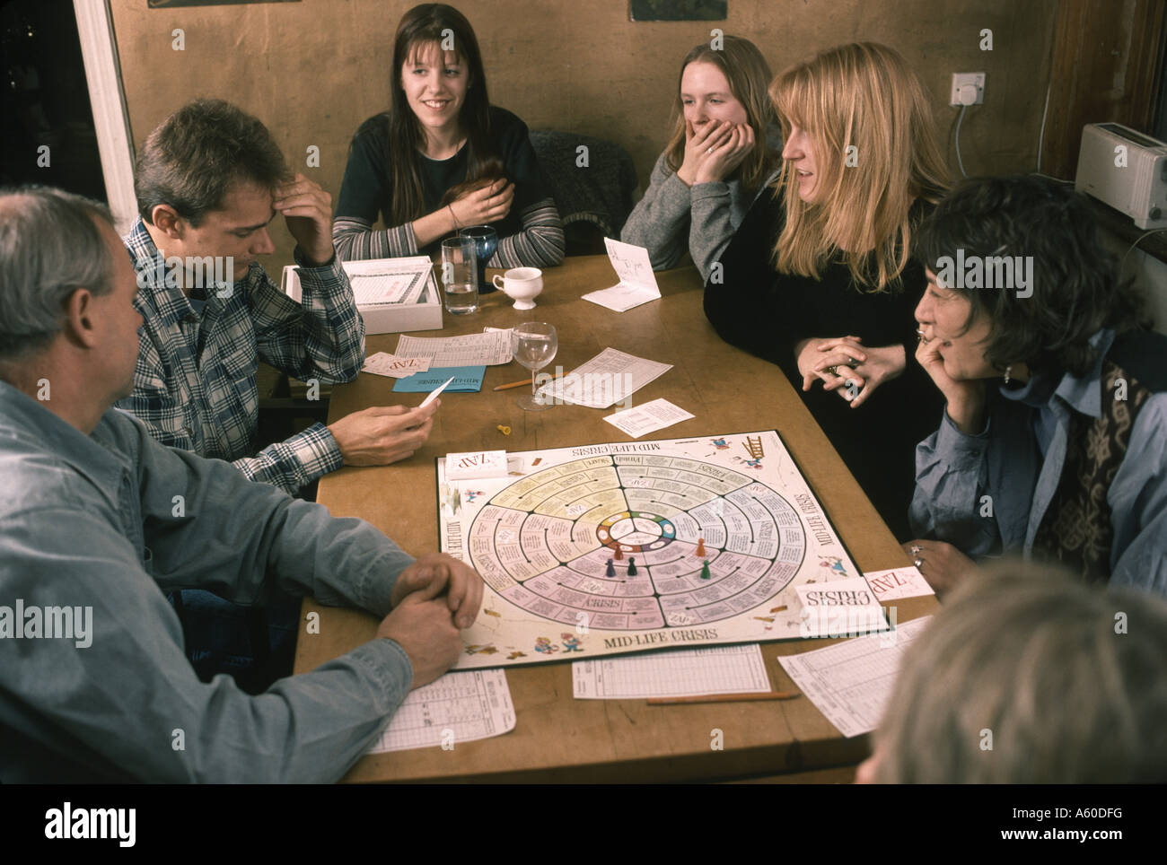 extended family playing a board game Stock Photo - Alamy