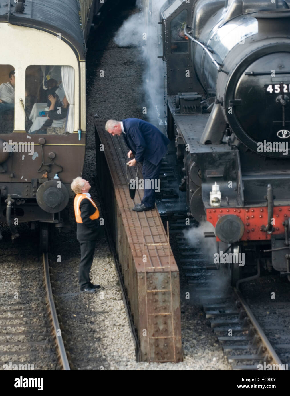 Drivers handing over the section key on steam railway Stock Photo - Alamy