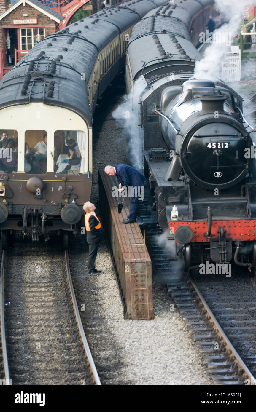 Drivers handing over the section key on steam railway Stock Photo - Alamy