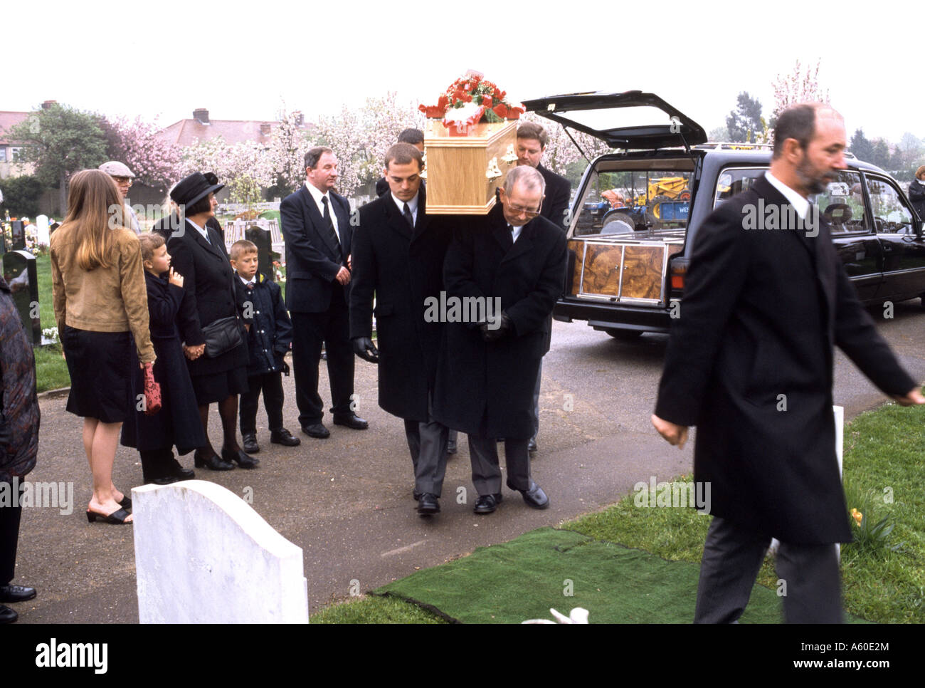 Burial scene in church cemetery Stock Photo - Alamy