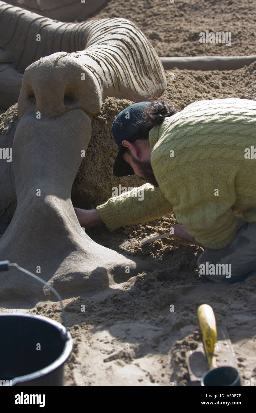 Man making sand sculpture Stock Photo - Alamy