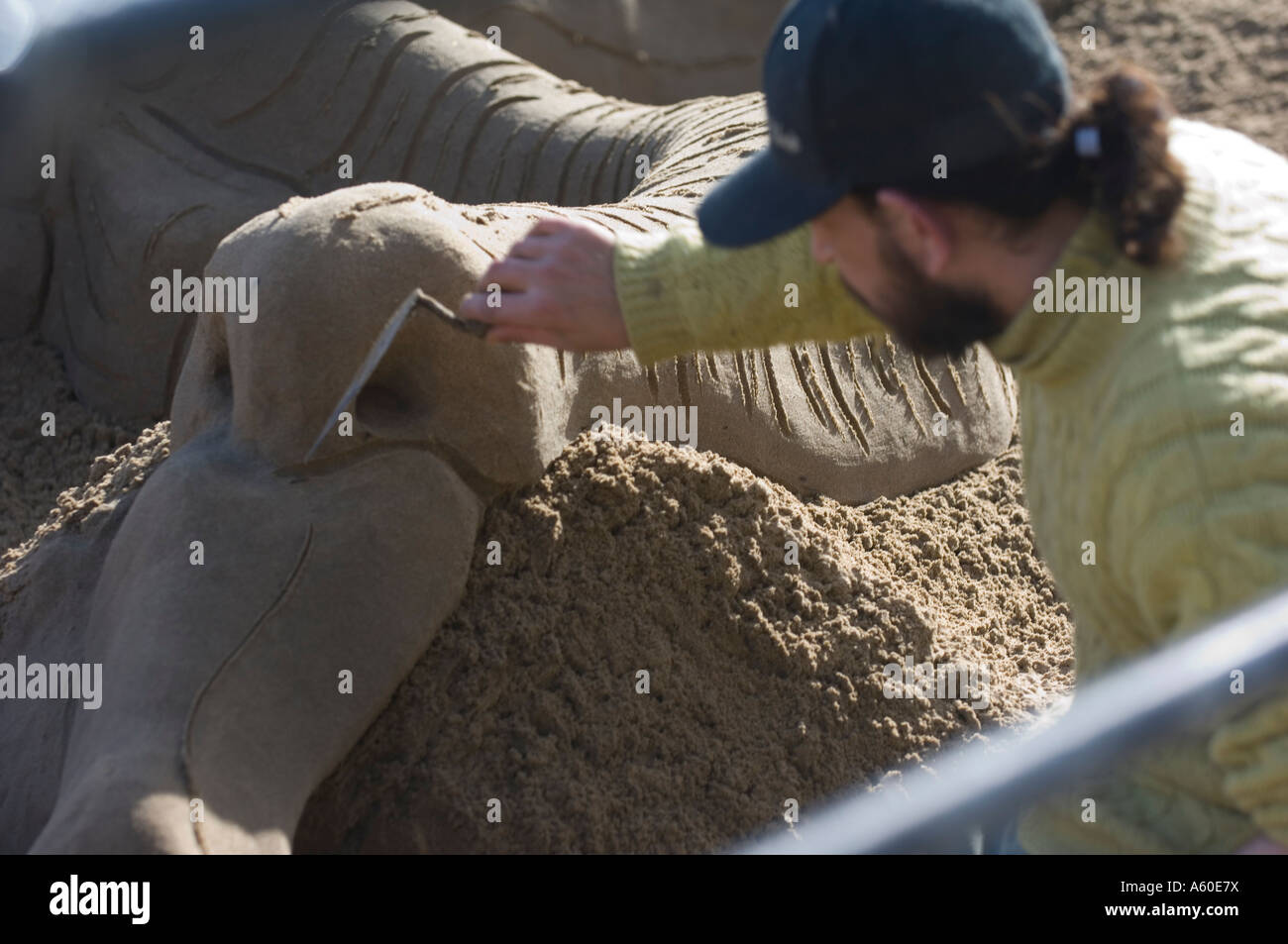 Man making sand sculpture Stock Photo - Alamy