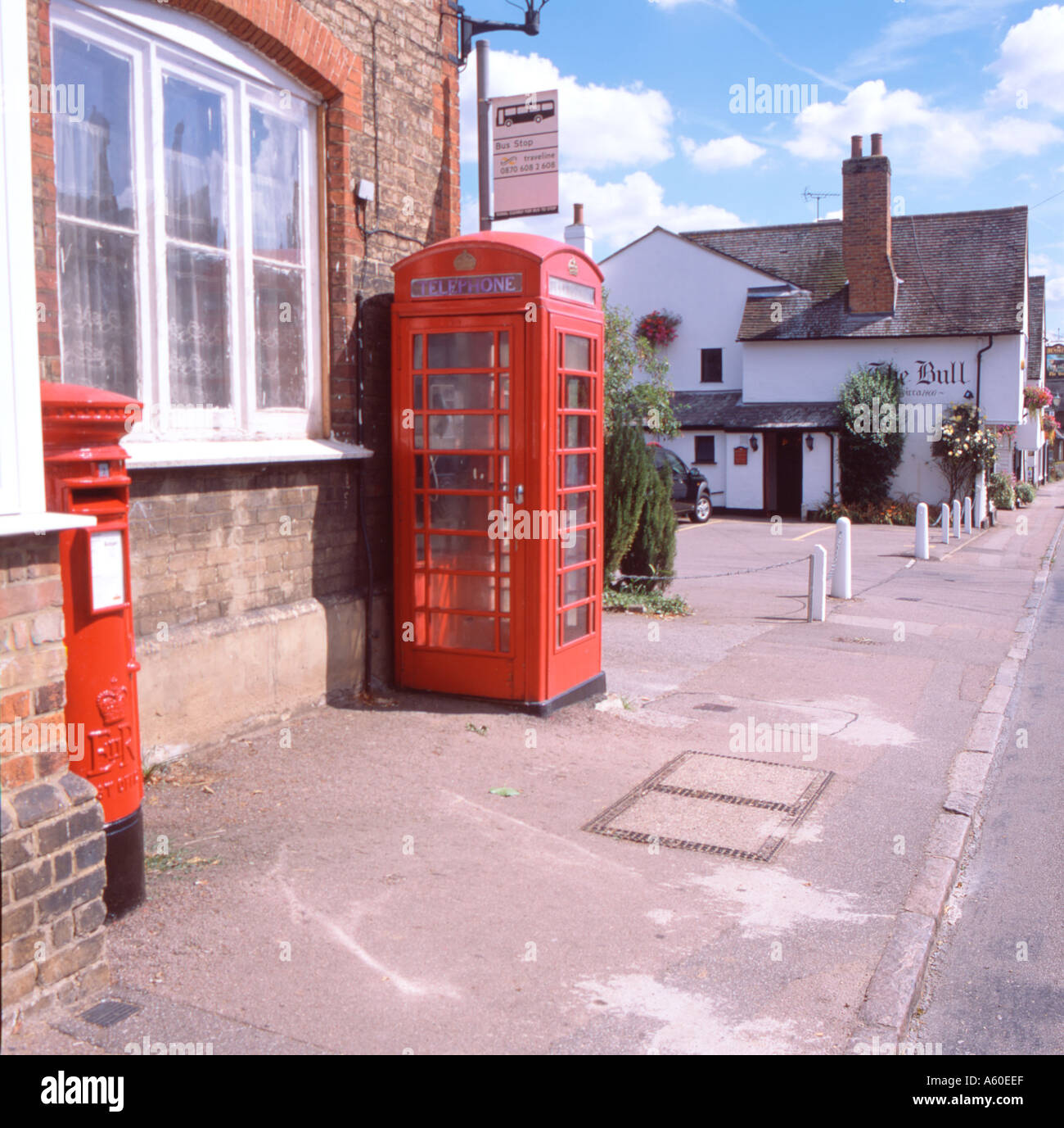 village red telephone box and post box Stock Photo - Alamy