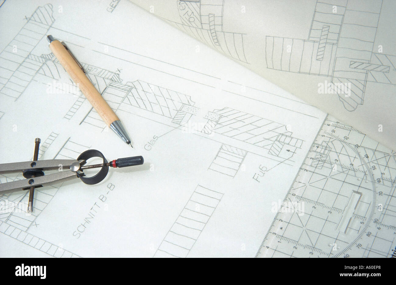 Drawing compass and pen on drawing board Stock Photo - Alamy