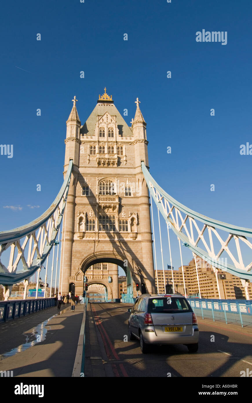 Vertical view of the impressive gothic towers from on Tower Bridge on a ...