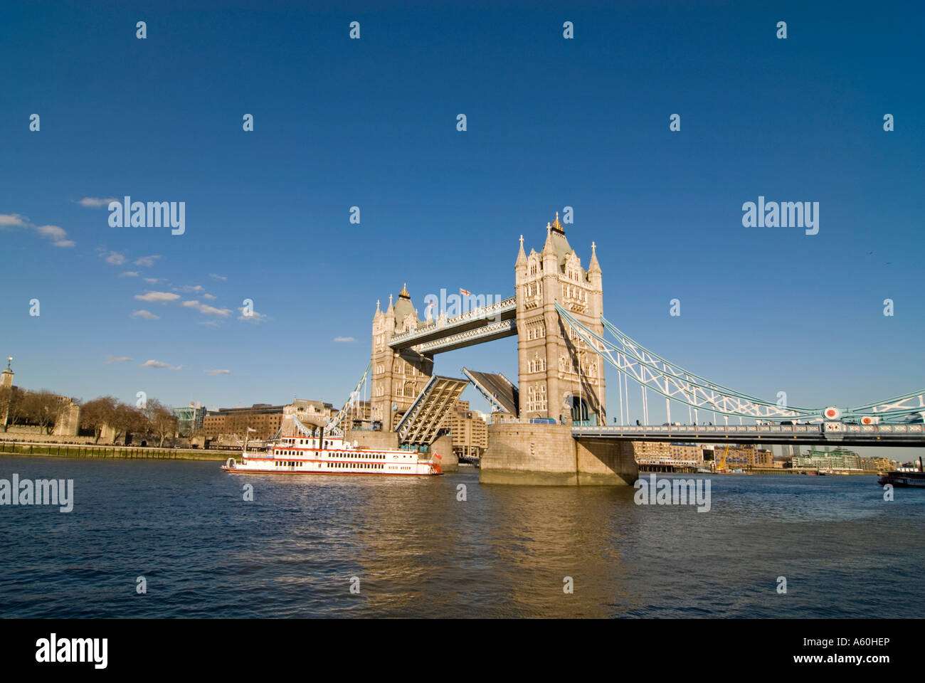 Horizontal wide angle of Tower Bridge being raised to allow a paddle ...