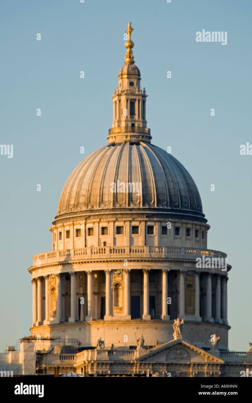 Vertical close up of the dome of St Paul's Cathedral glowing against a ...