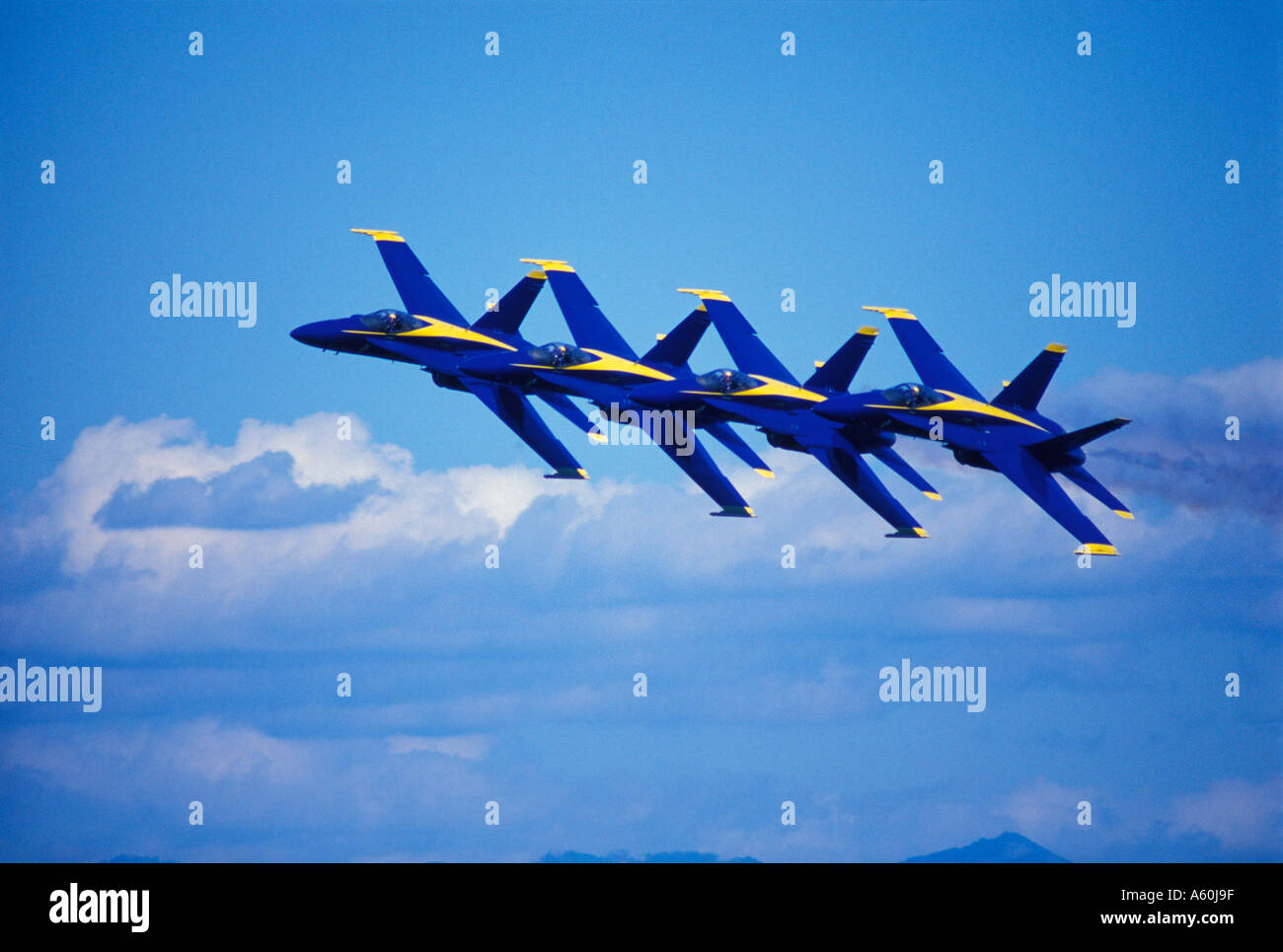 Four FA 18 fighter jets fly in tight formation as part of a Blue Angels ...