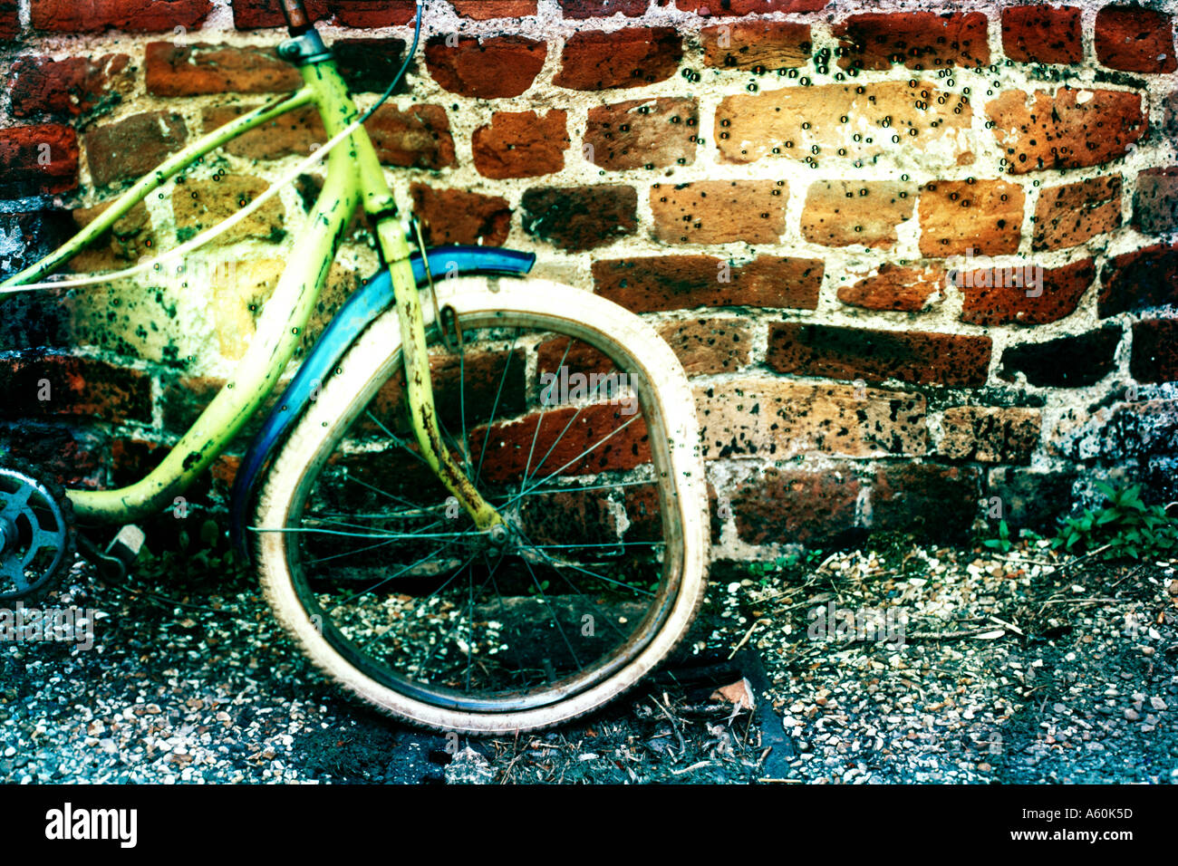 bicycle against brick wall Stock Photo - Alamy
