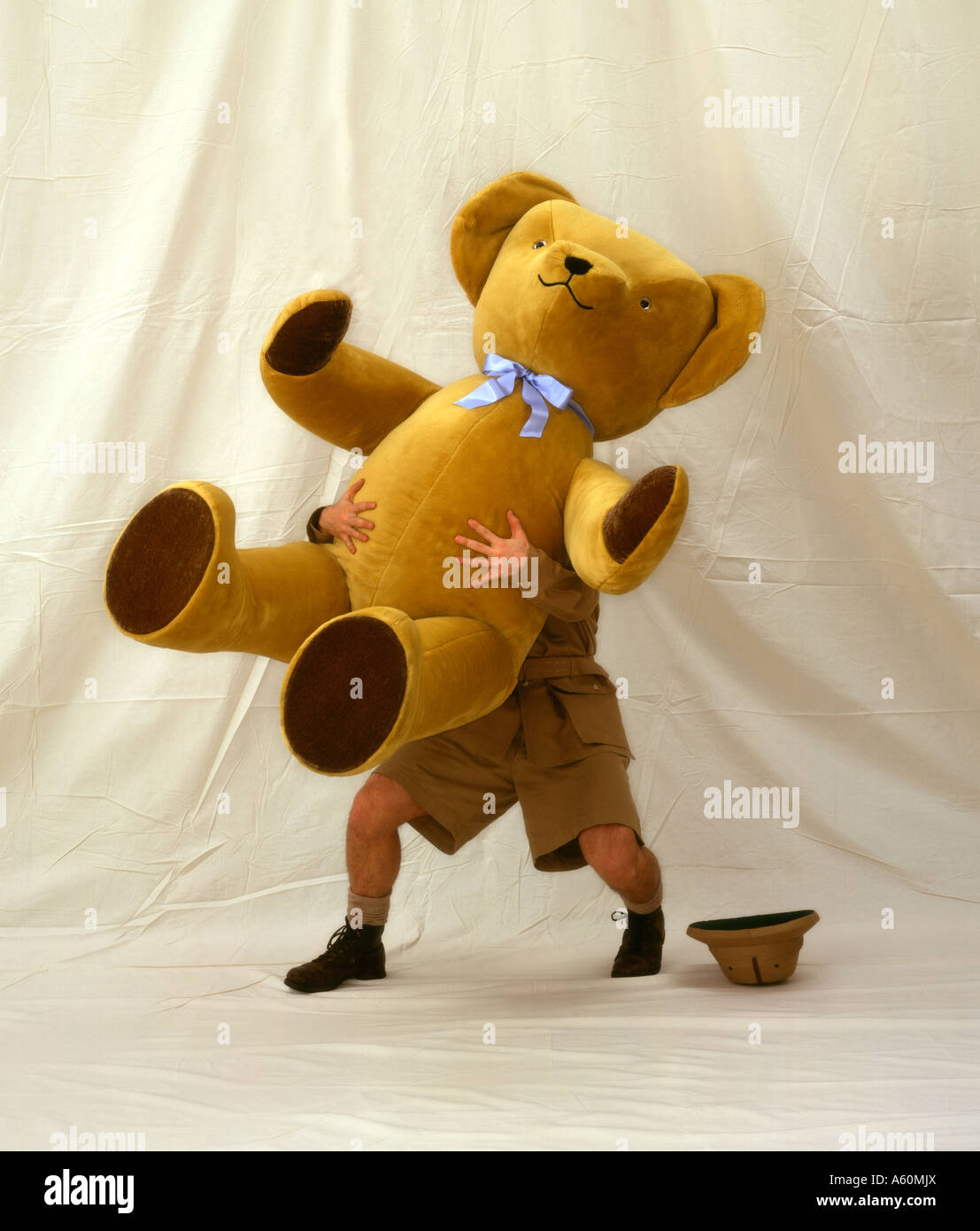 Giant Teddy Bear being carried by Hunter Stock Photo - Alamy