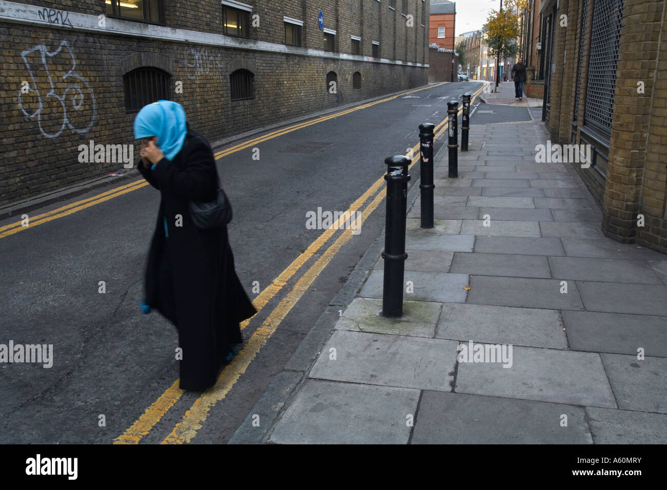 Muslim woman walking alone in London Stock Photo - Alamy