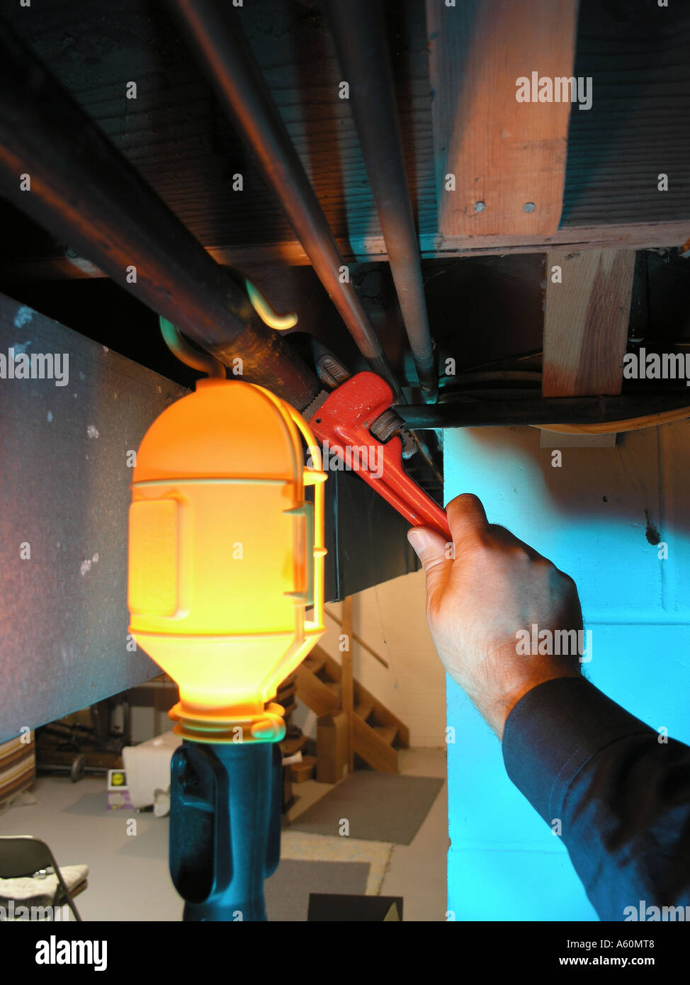 Plumbing Repair - Overhead Pipes Stock Photo - Alamy