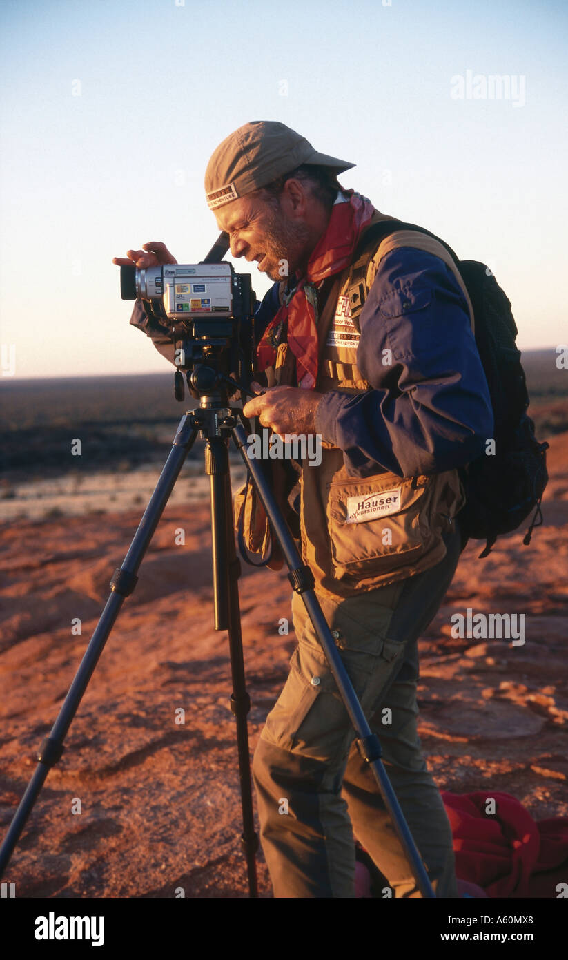 Side profile of man filming on landscape Walga Rock Australia Stock ...